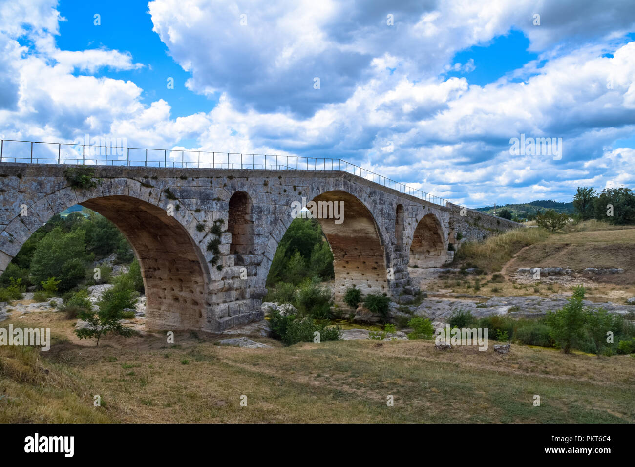 The Roman Bridge of Pont Julien, dating from 3 BC, near the village of ...