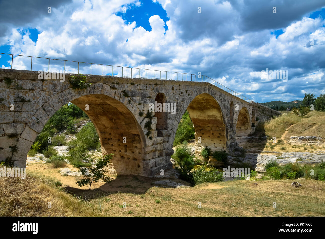 The Roman Bridge of Pont Julien, dating from 3 BC, near the village of ...