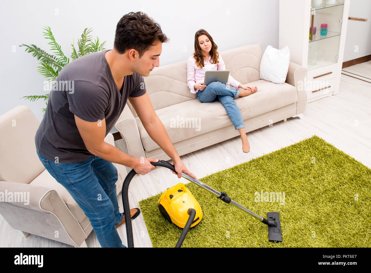 Cleaning the house with vacuum cleaner Stock Photo - Alamy