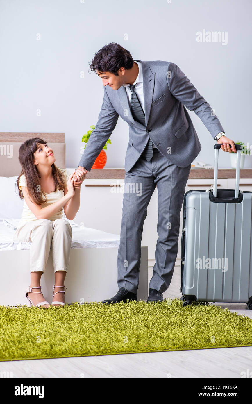 Wife seeing her husband off to business trip Stock Photo - Alamy