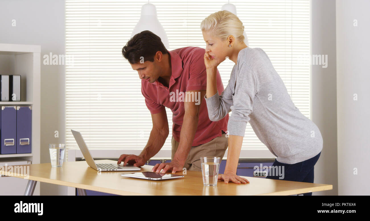 Businessteam working hard in the office Stock Photo - Alamy