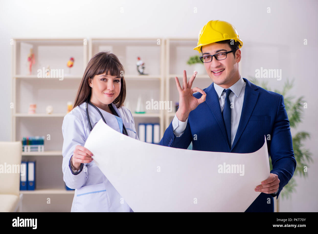Doctor discussing new hospital plan with architect Stock Photo - Alamy