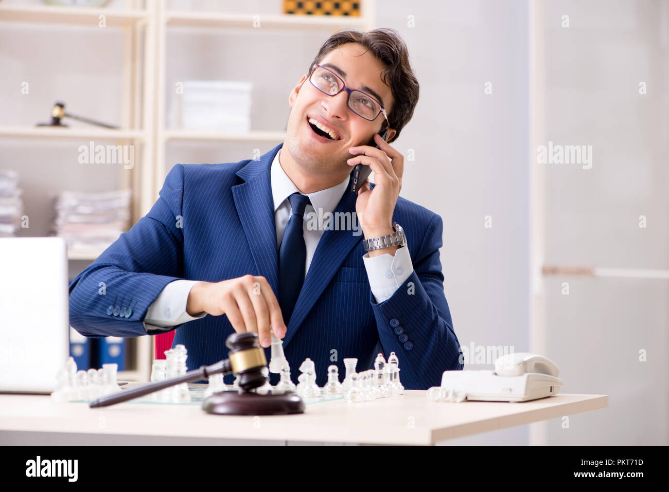 Young lawyer playing chess to train his court strategy and tactics ...