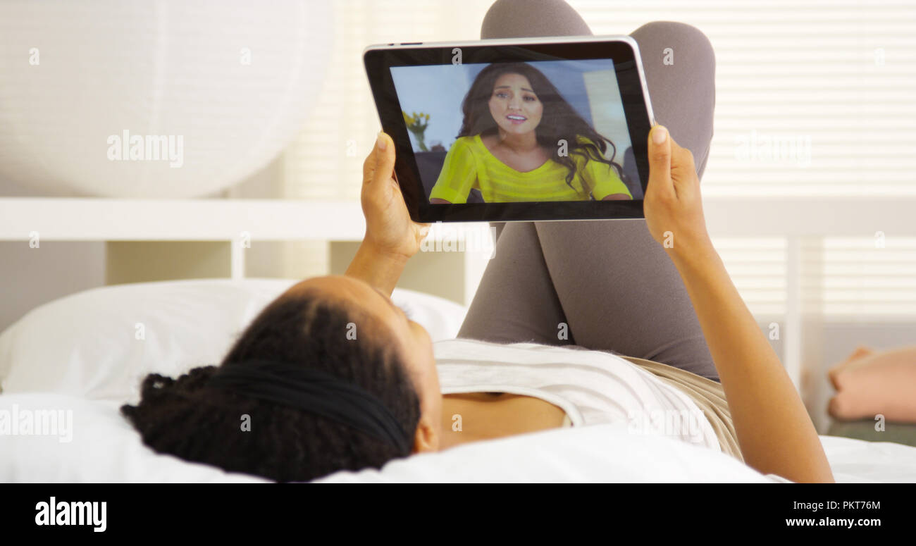Multi-ethnic friends vidoe chatting with tablet Stock Photo - Alamy