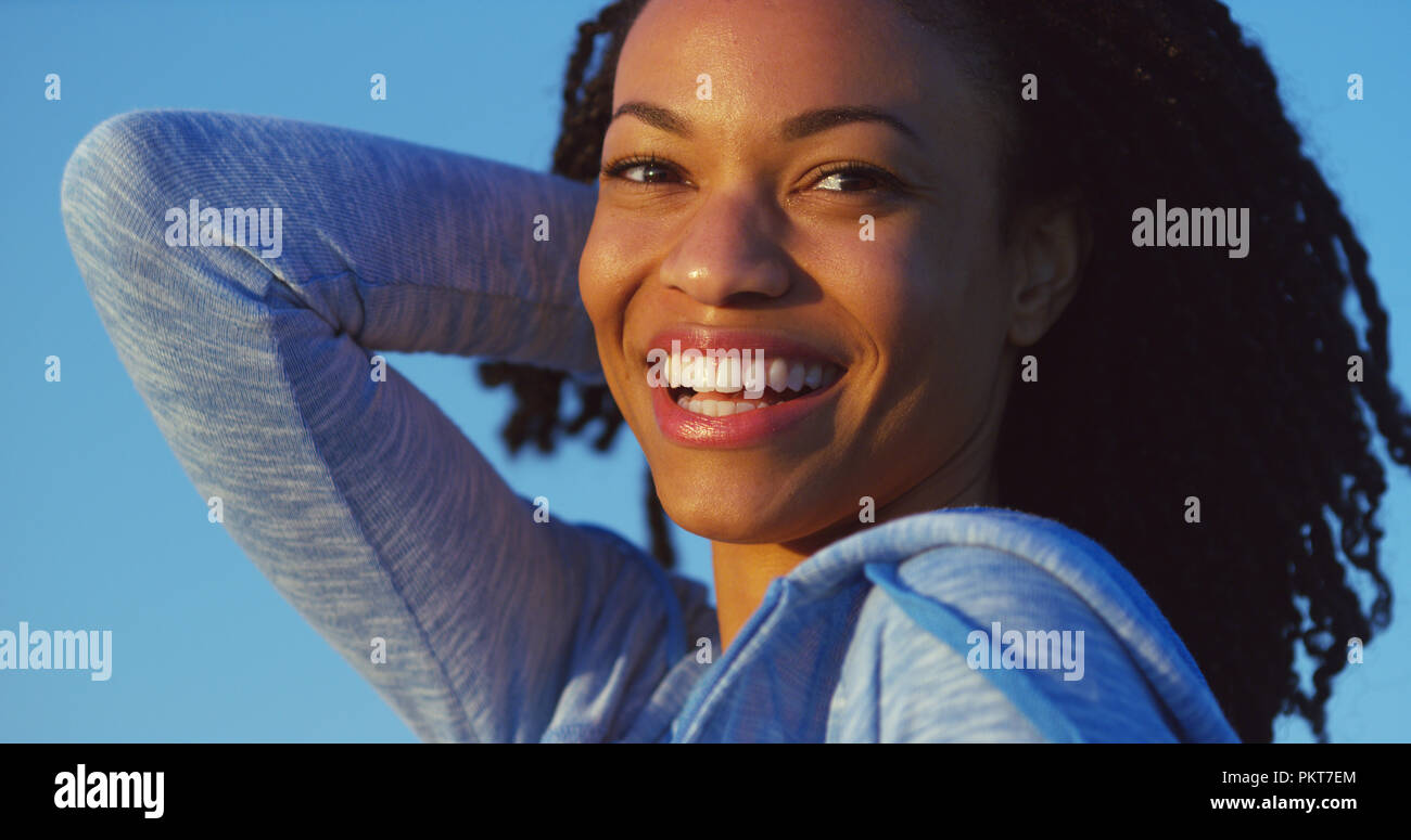 Black woman smiling and laughing Stock Photo - Alamy