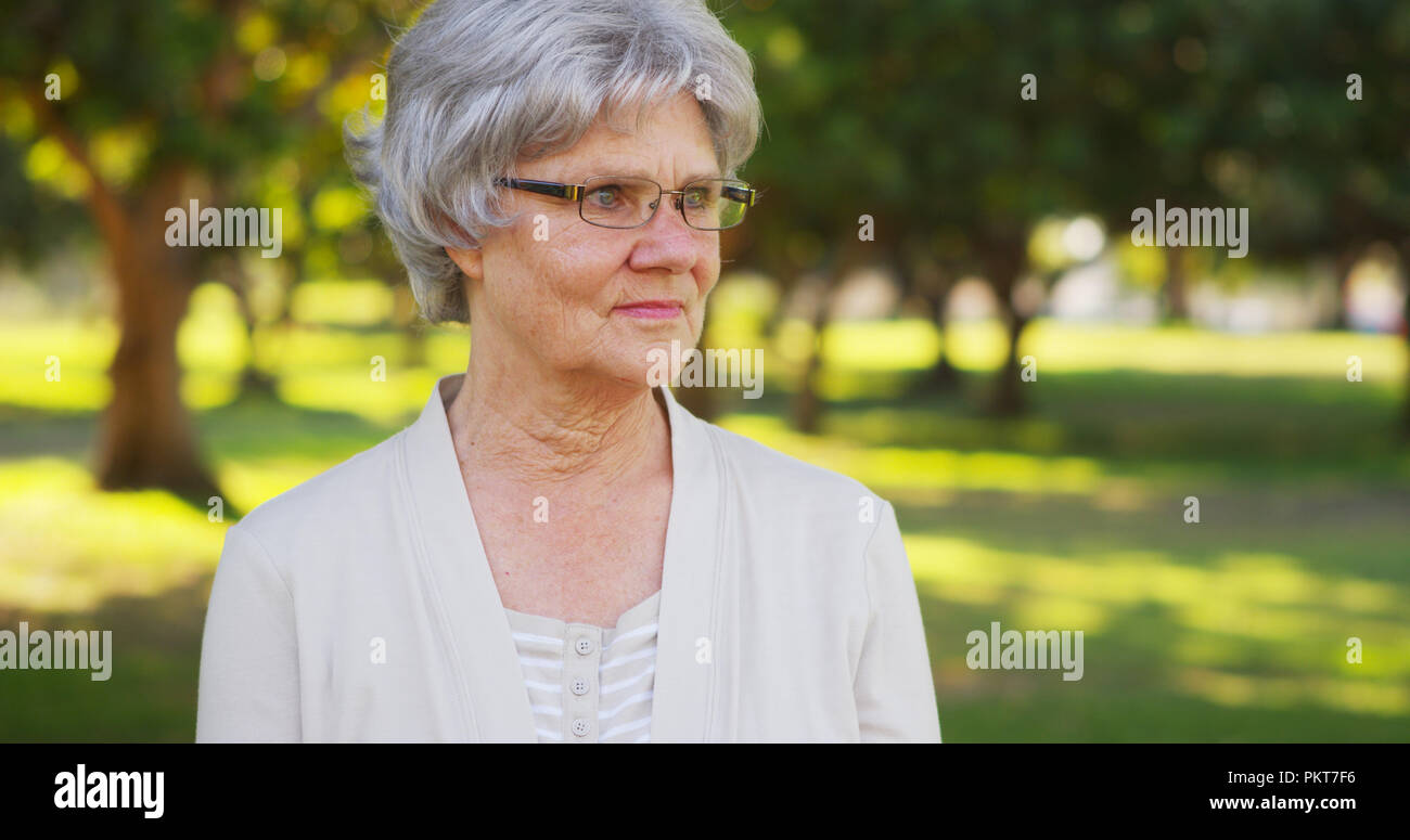 Senior woman looking off into the distance Stock Photo - Alamy