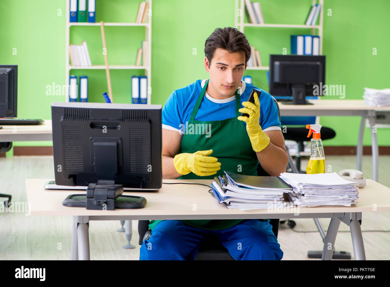 Male spy under cleaner cover stealing confidential documents Stock ...