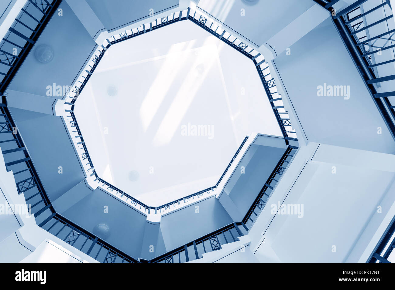 Rotating stairs, blue toned illustration Stock Photo - Alamy