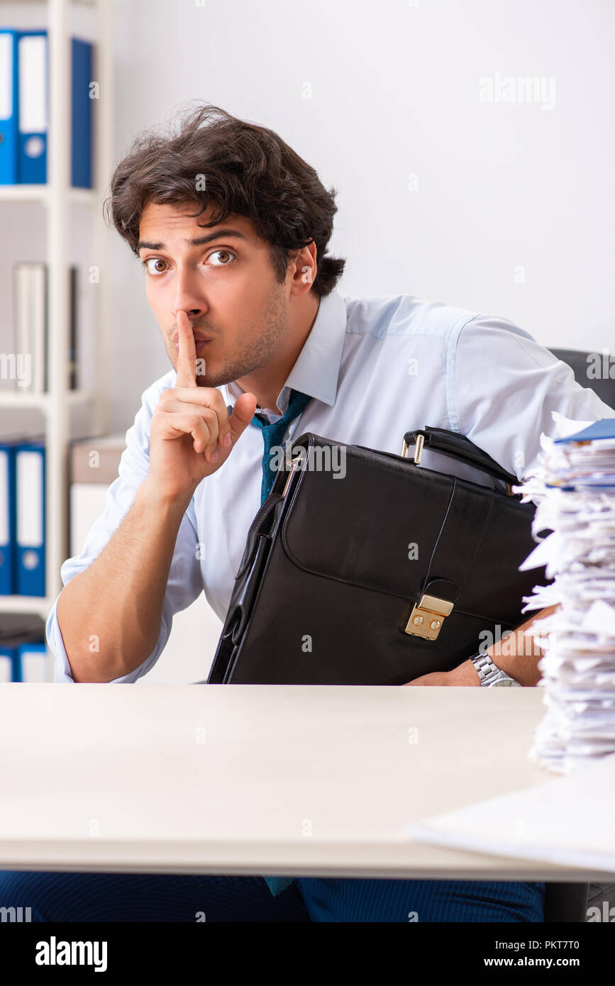 Overloaded busy employee with too much work and paperwork Stock Photo ...