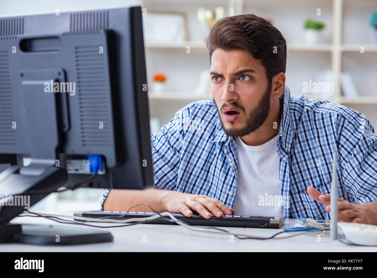 Frustrated young man due to weak internet reception Stock Photo - Alamy