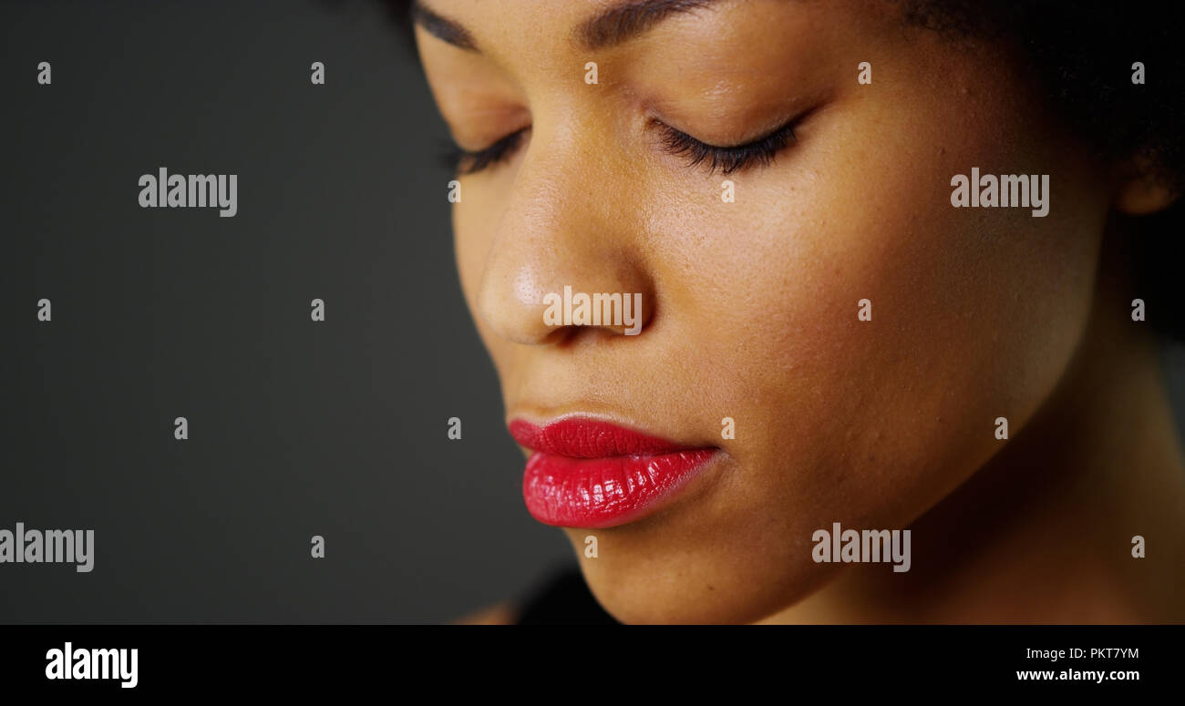 Close up slow pan up of African woman with eyes closed Stock Photo - Alamy