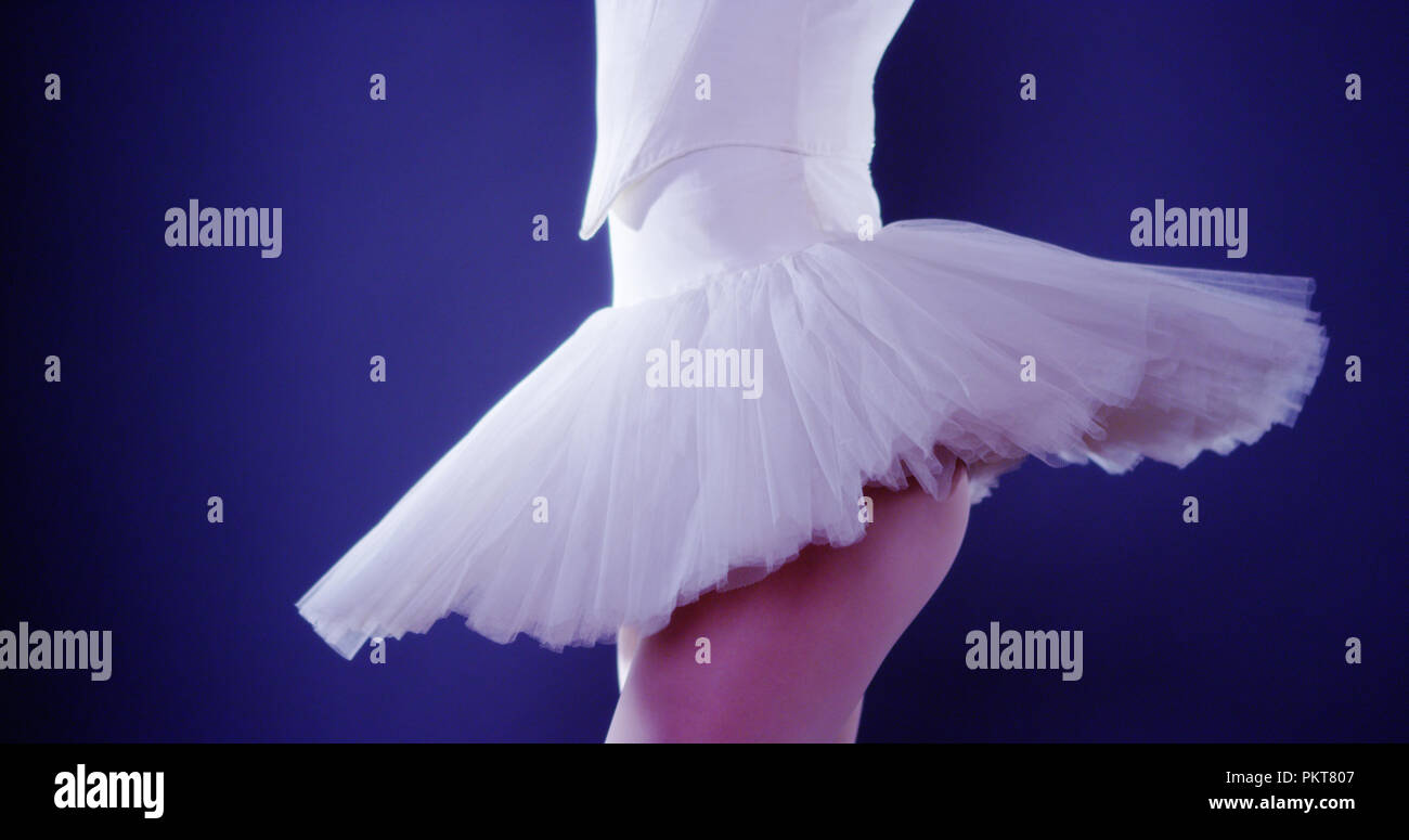 Woman ballet dancer turning around while standing on tiptoes Stock ...