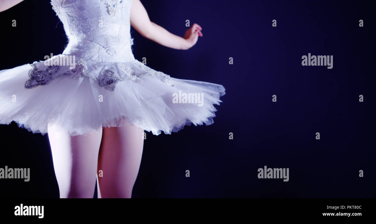 Ballet dancer standing on tiptoes in white tutu Stock Photo - Alamy