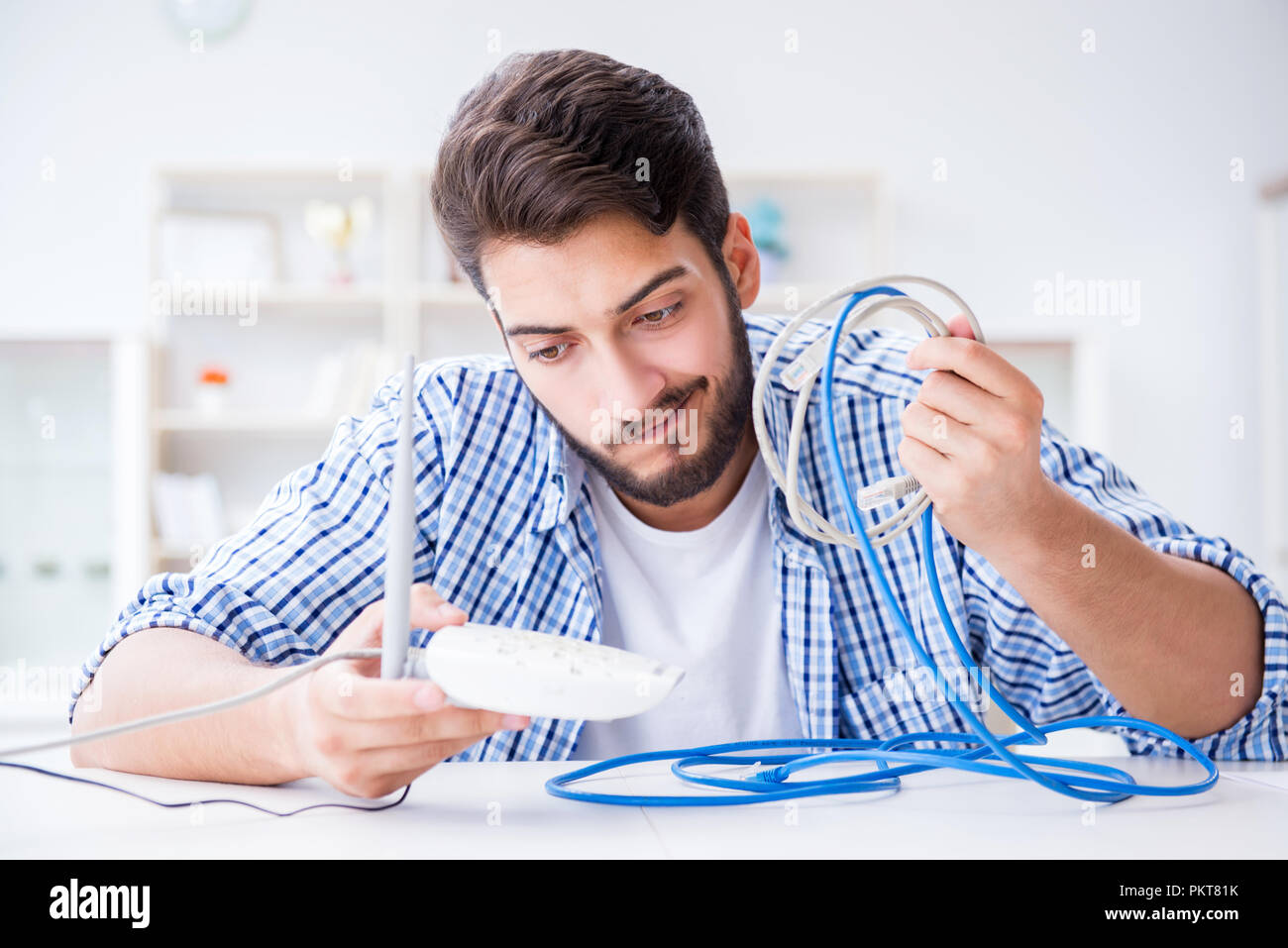 Frustrated young man due to weak internet reception Stock Photo - Alamy