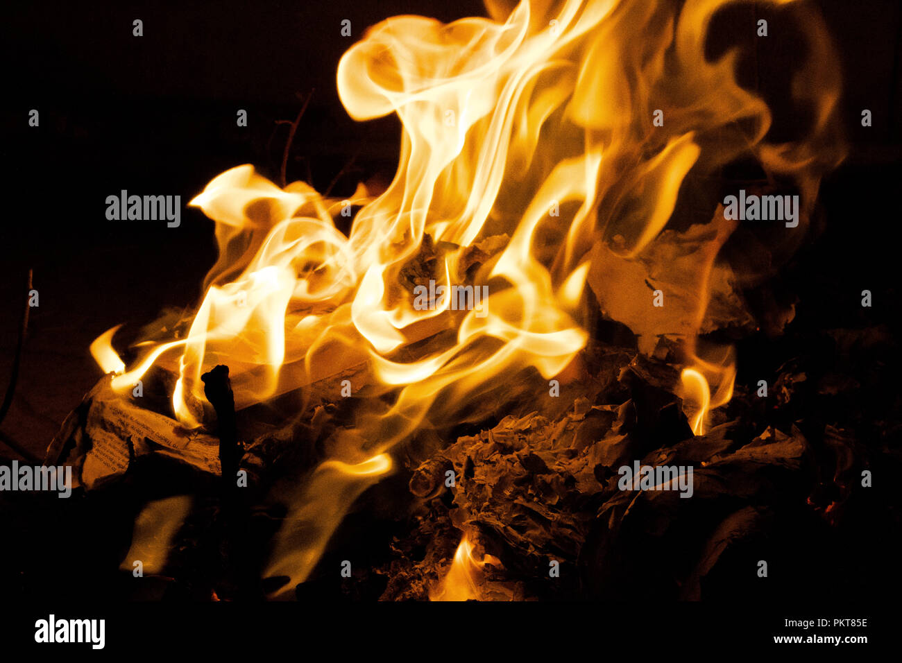 this is yellow orange fire burning paper Stock Photo - Alamy