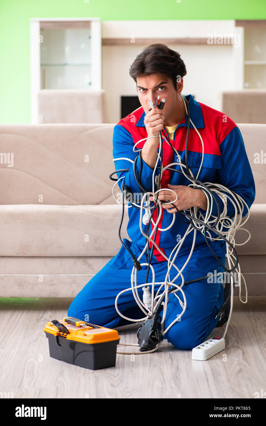 Electrician contractor with tangled cables Stock Photo - Alamy