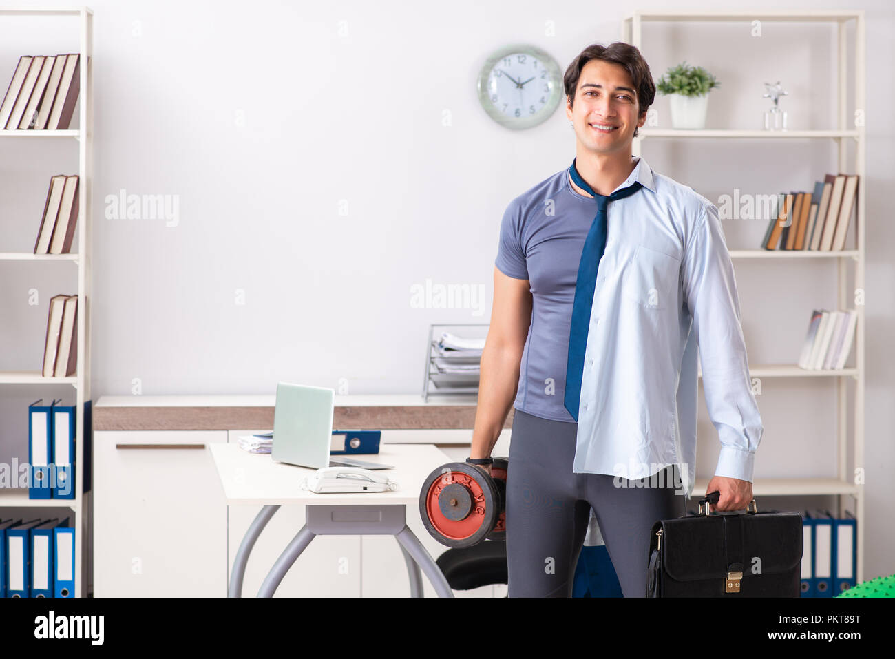 Employee combining work and healthy lifestyle Stock Photo - Alamy