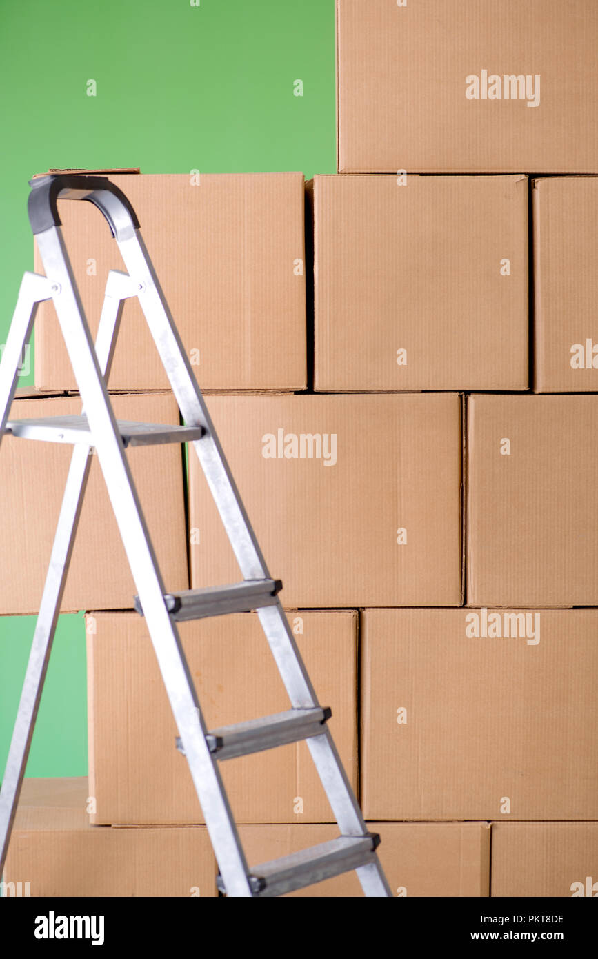 Many boxes and ladder in depot Stock Photo - Alamy