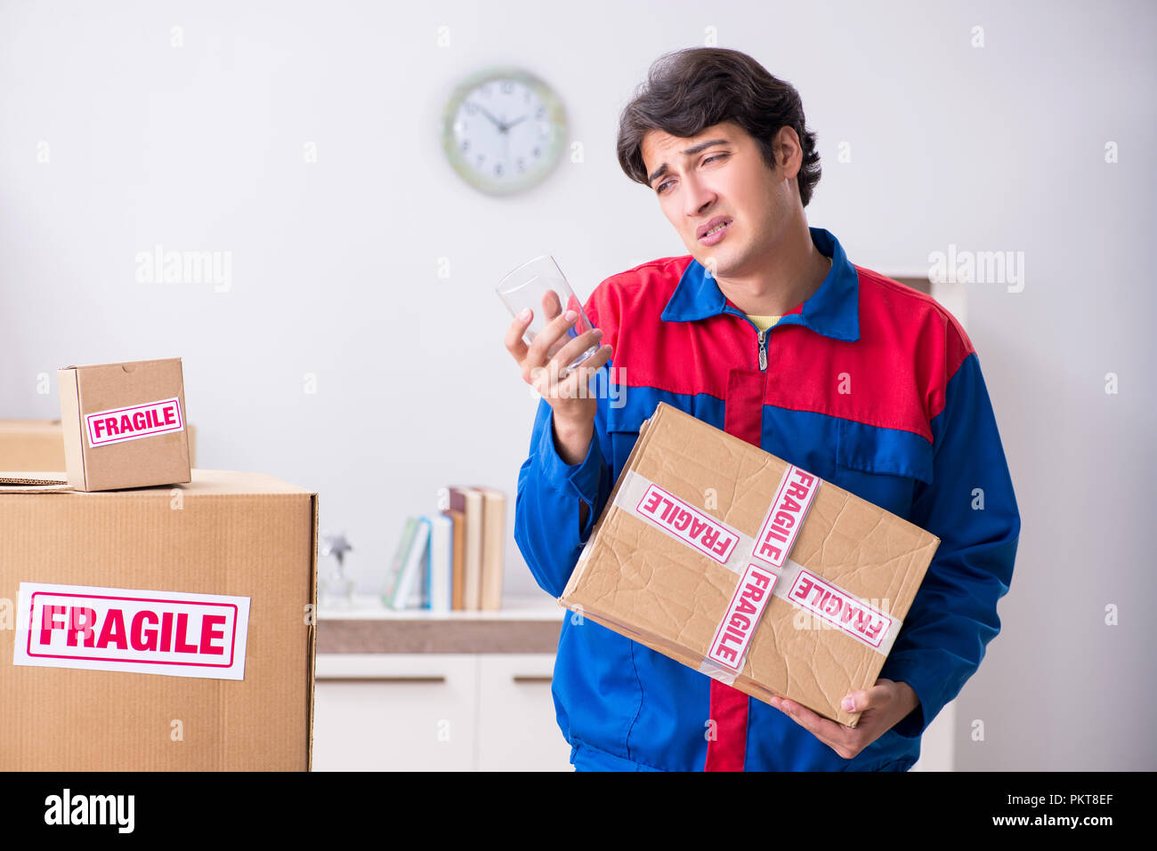 Transportation contractor with fragile boxes Stock Photo - Alamy