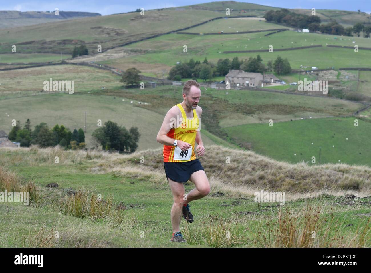 Little Hayfield, High Peak Derbyshire UK 15 September 2018 A runner in ...