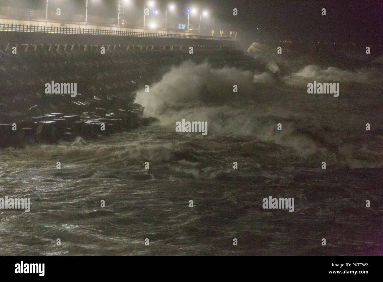 Big rough waves creashing into coastline during typhoon hurricane storm ...