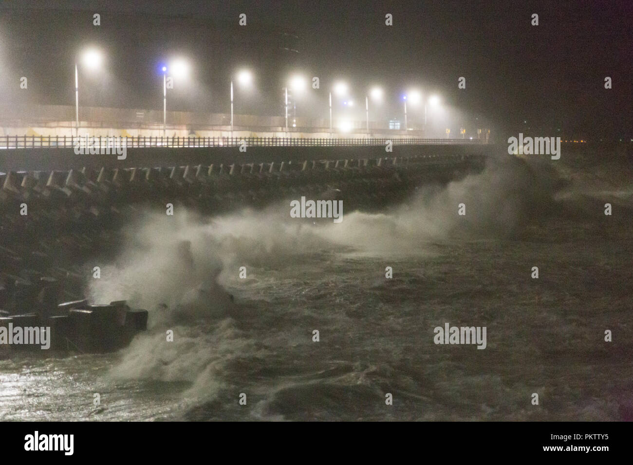 Big rough waves creashing into coastline during typhoon hurricane storm ...
