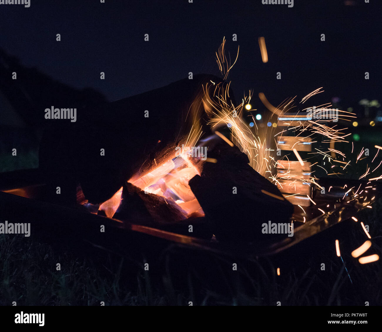 Flames from campfire barbecue at night Stock Photo - Alamy