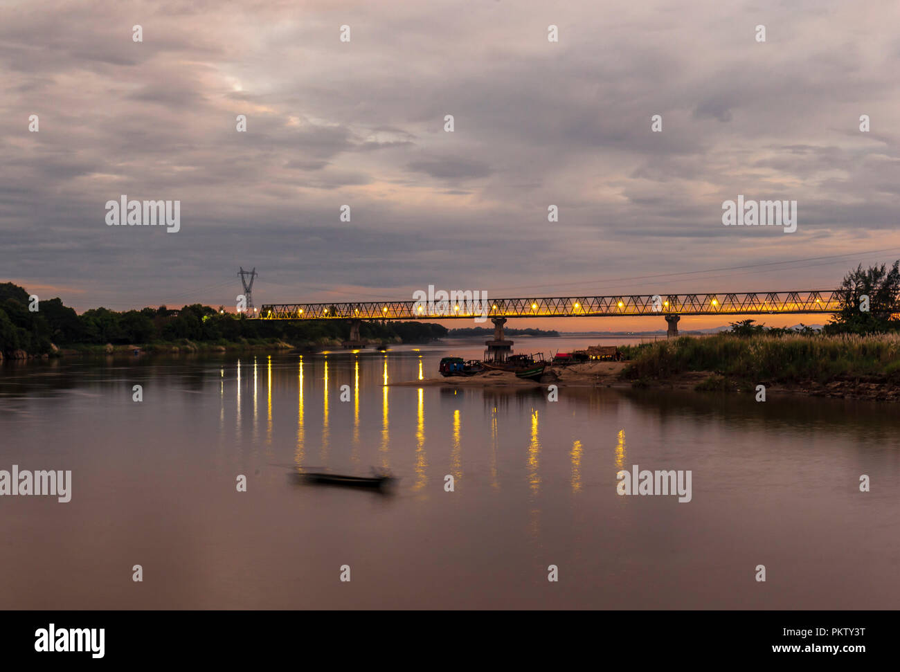 Sunset with a bridge leading over Thanlyin river in Hpa An, Myanmar ...