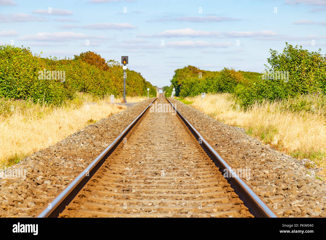 Train rail with vegetation and signs around, Galway, Ireland Stock ...