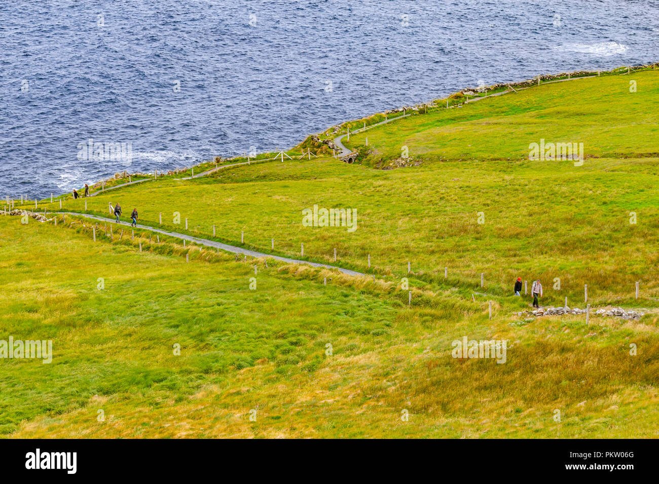 Cliffs of Moher trail with farm fields and ocean, Doolin, Clare ...