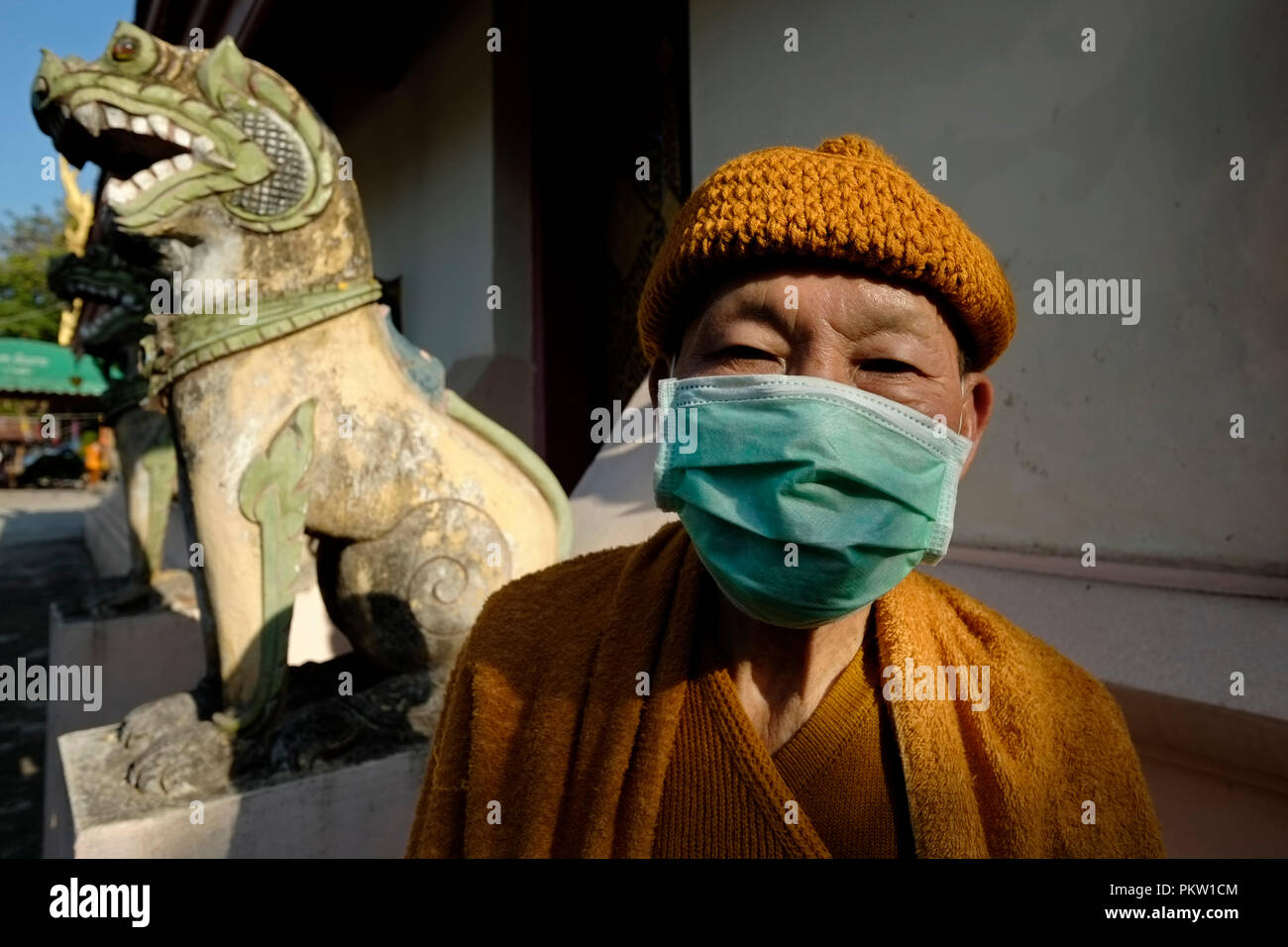 Facemask in the temple hi-res stock photography and images - Alamy