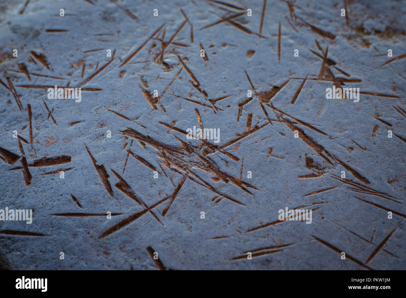 Gouges in an iron bollard Stock Photo - Alamy