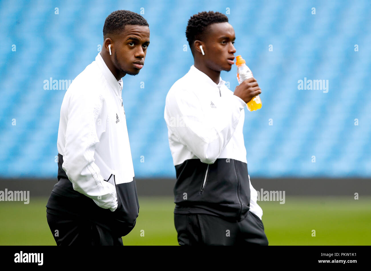 Fulham's Ryan Sessegnon (left) inspects the pitch prior to the Premier ...