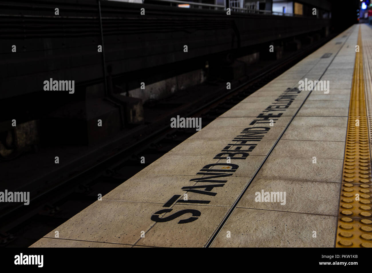 Stand behind the yellow line, sign hi-res stock photography and images ...
