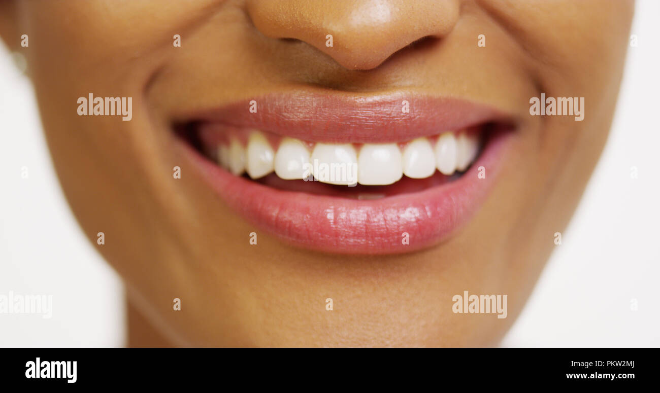 Close up of African woman with white teeth smiling Stock Photo - Alamy