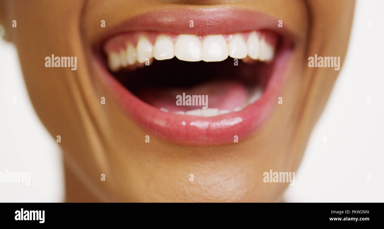 Close up of African woman with white teeth smiling Stock Photo - Alamy
