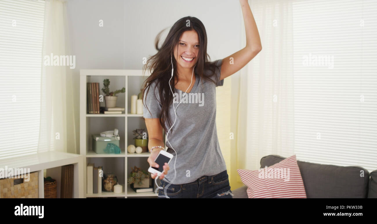 Pretty woman dancing in her living room Stock Photo - Alamy