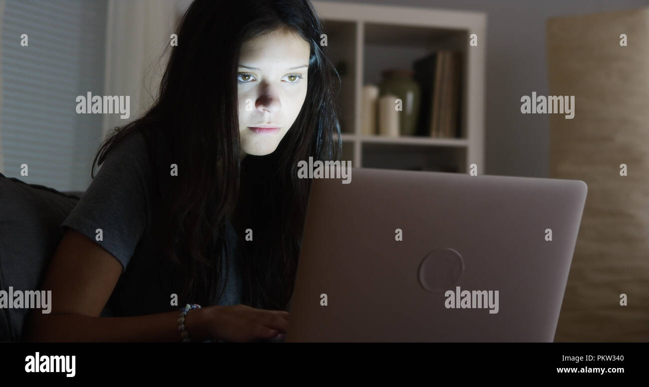 College student writing her paper late at night Stock Photo - Alamy