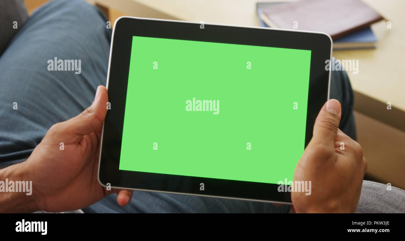 Woman holds tablet green screen hi-res stock photography and images - Alamy