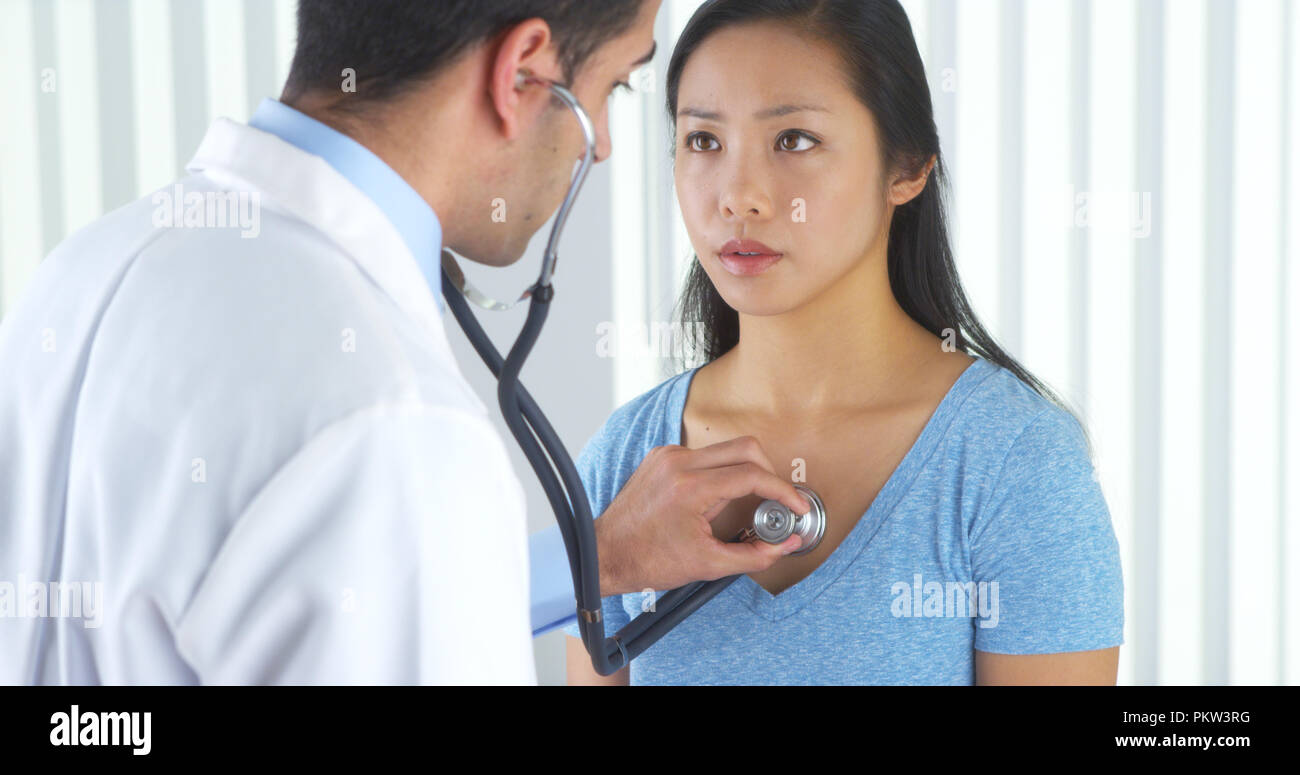 Mexican doctor listening to patient's heart Stock Photo - Alamy