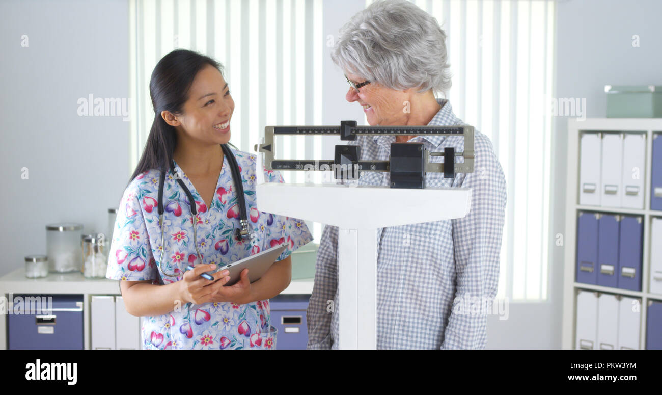 Mature woman scales doctor hi-res stock photography and images - Alamy
