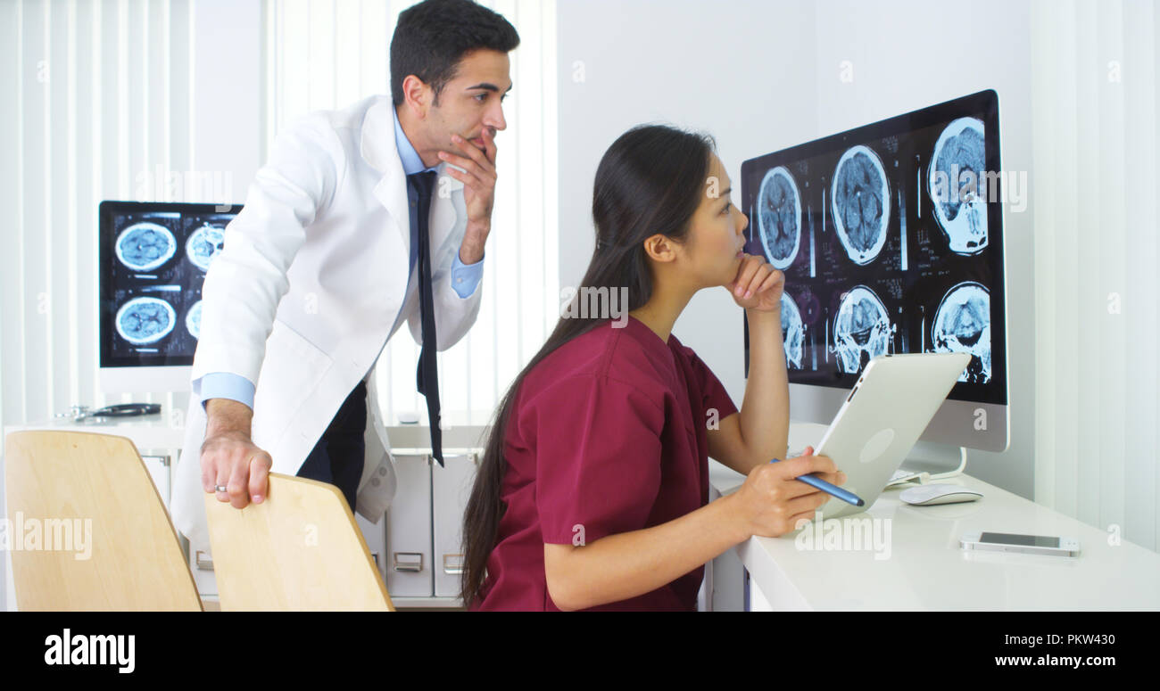 Diverse medical team working in the office together Stock Photo - Alamy