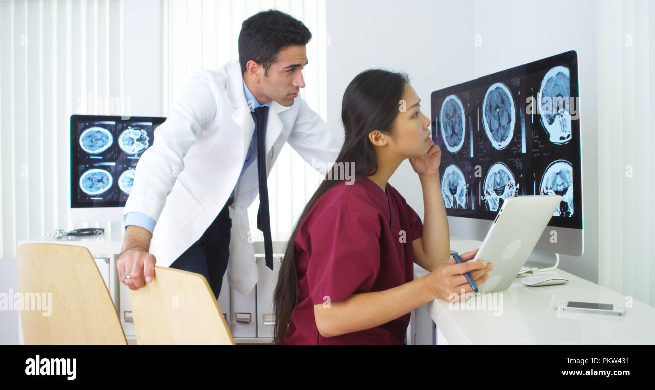 Multiethnic medical research team working at desk Stock Photo - Alamy