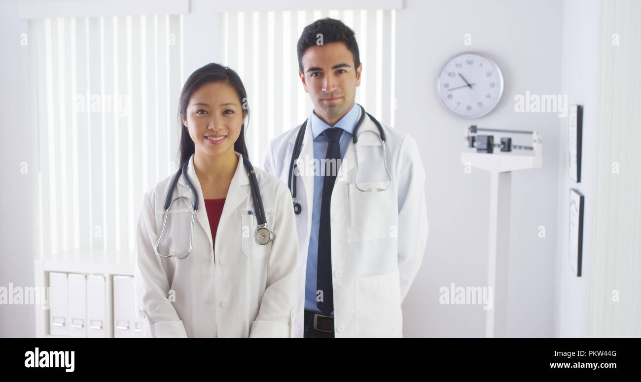 Happy doctors standing in office Stock Photo - Alamy