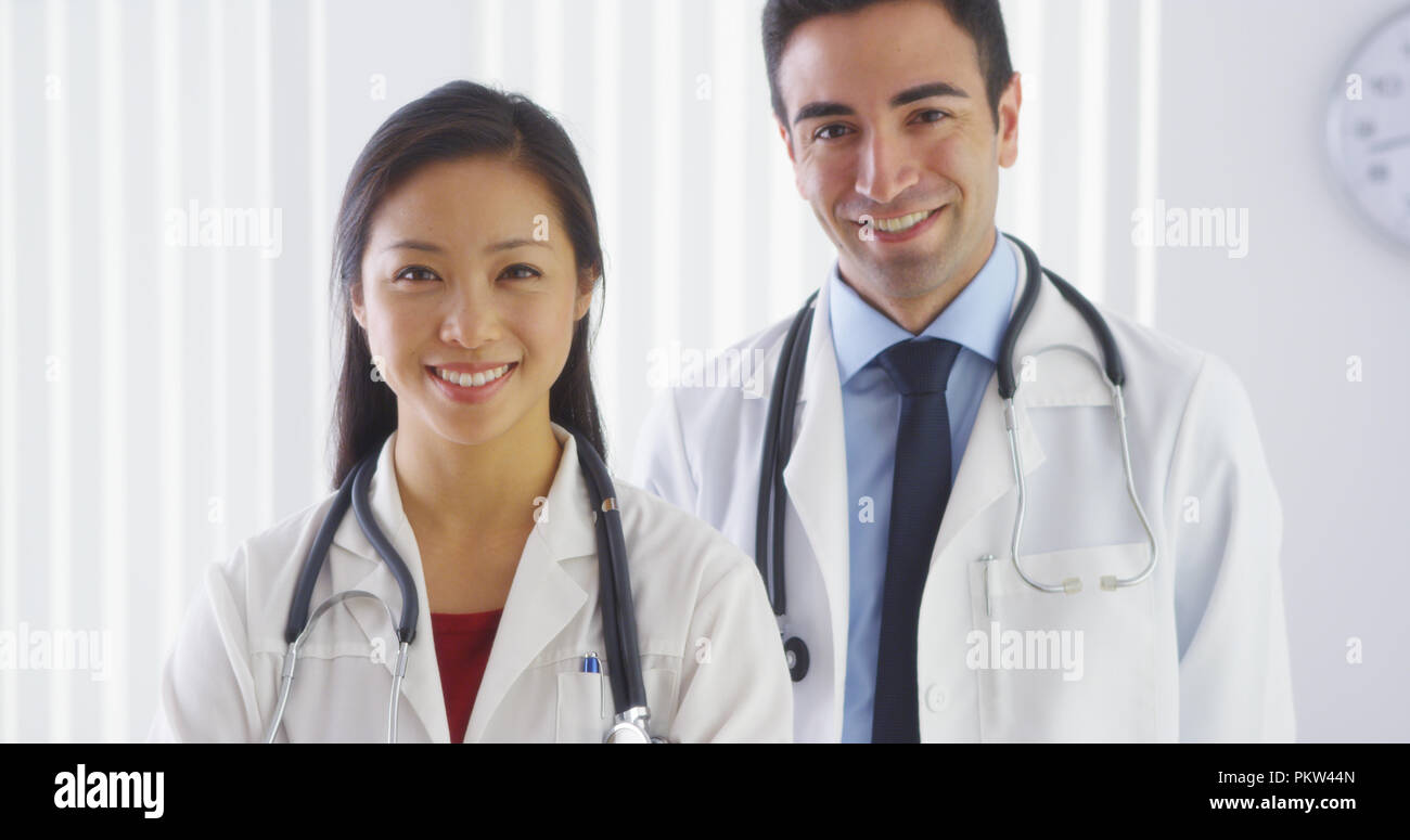 Portrait of two doctors smiling Stock Photo - Alamy