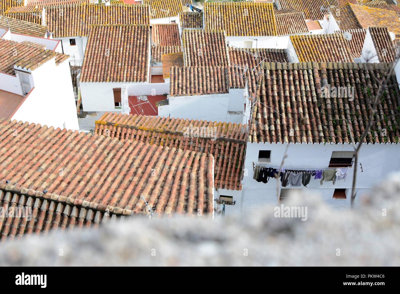 High angle panoramic view of roofs of andalusian white village of ...