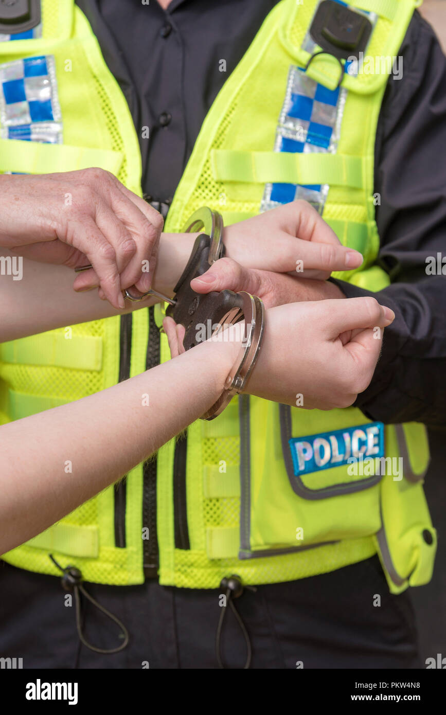 Officers Handcuffs Stock Photos & Officers Handcuffs Stock Images - Alamy