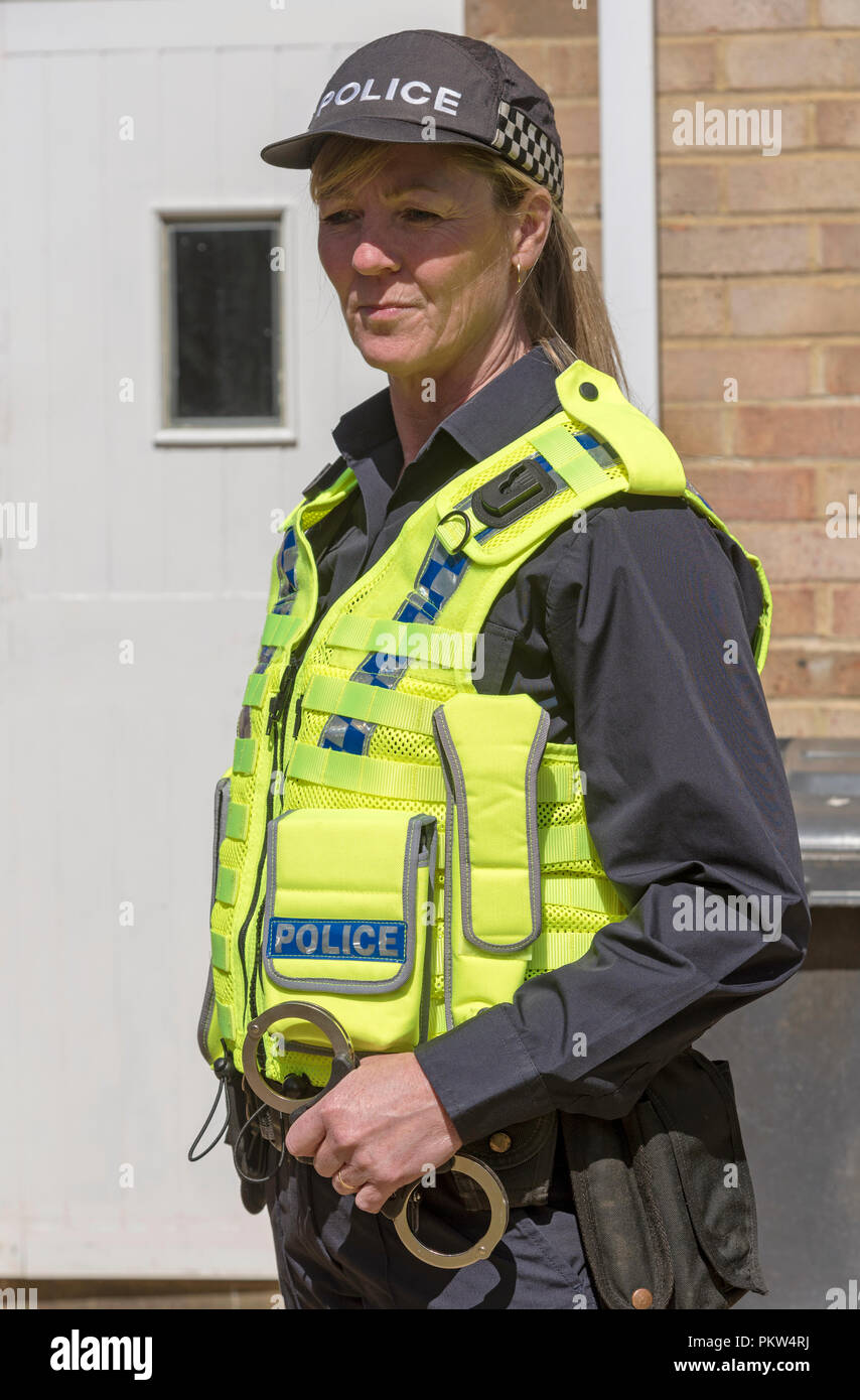 Police office with handcuffs at a crime scene Stock Photo - Alamy
