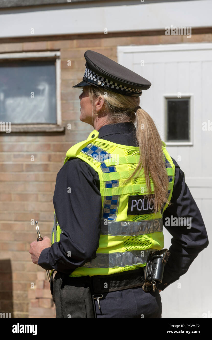 Police office with handcuffs at a crime scene Stock Photo - Alamy