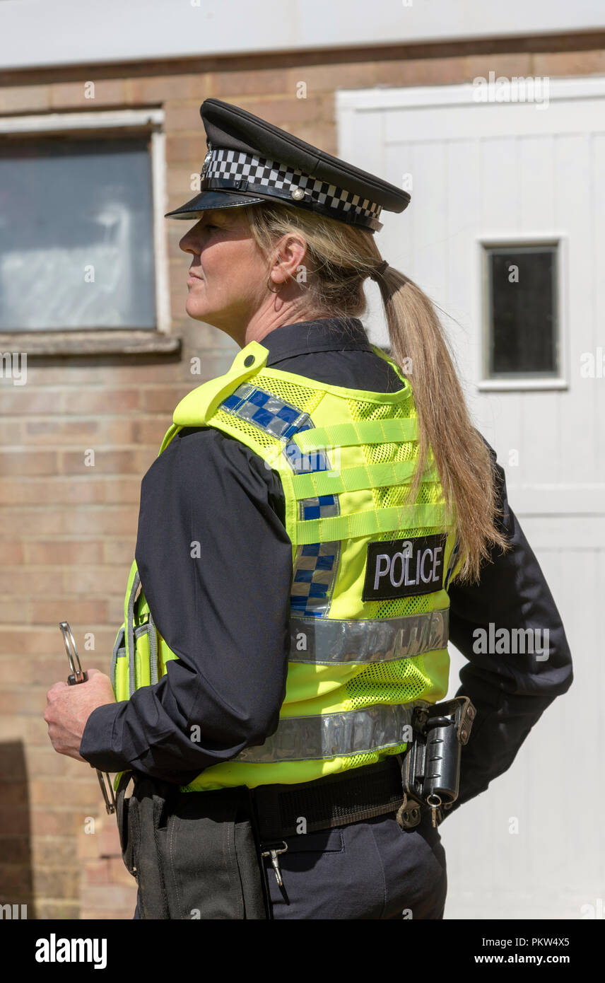 Police office with handcuffs at a crime scene Stock Photo - Alamy